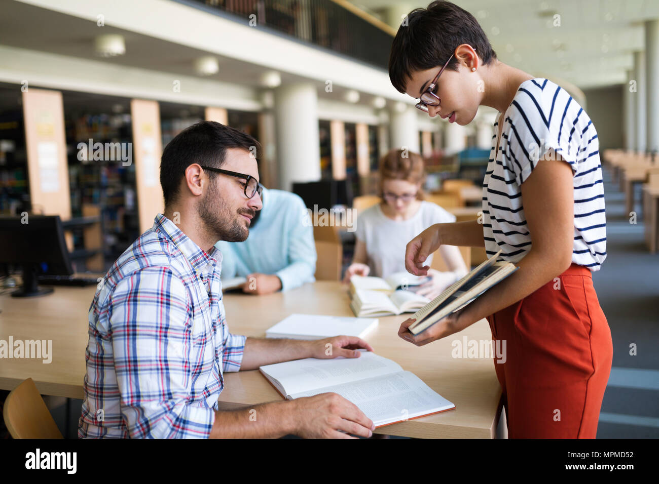 Group of young students studying together Stock Photo - Alamy