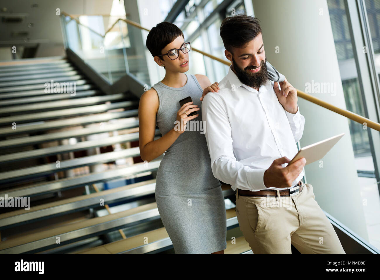 Picture of handsome man and beautiful woman as business partners Stock ...