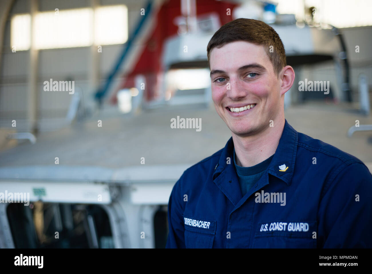 Petty Officer 3rd Class Perry Derrenbacher, a crewmember at Coast Guard ...