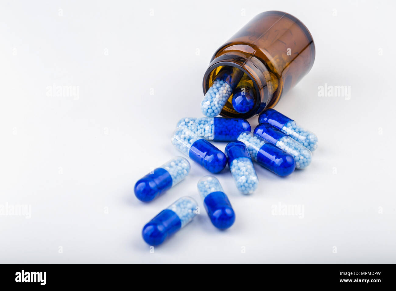 Bunch of blue pills with glass ampoules. Medical tools.Pharmaceutical ...