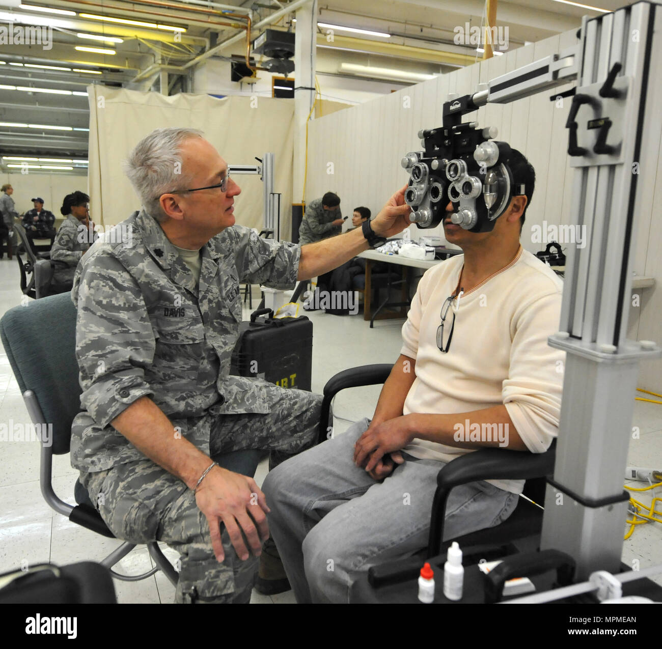 Lt. Col. Mark Davis with the 147th Medical Group adjusts a manual ...