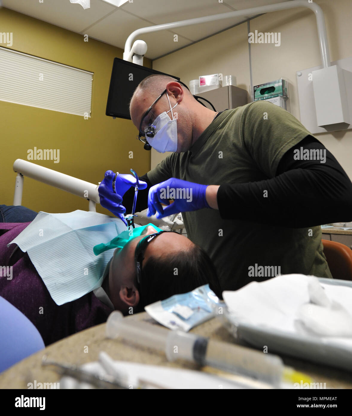 Navy Lt. Cmdr. Jason Allen attached to the Marine 4th Dental Battalion ...