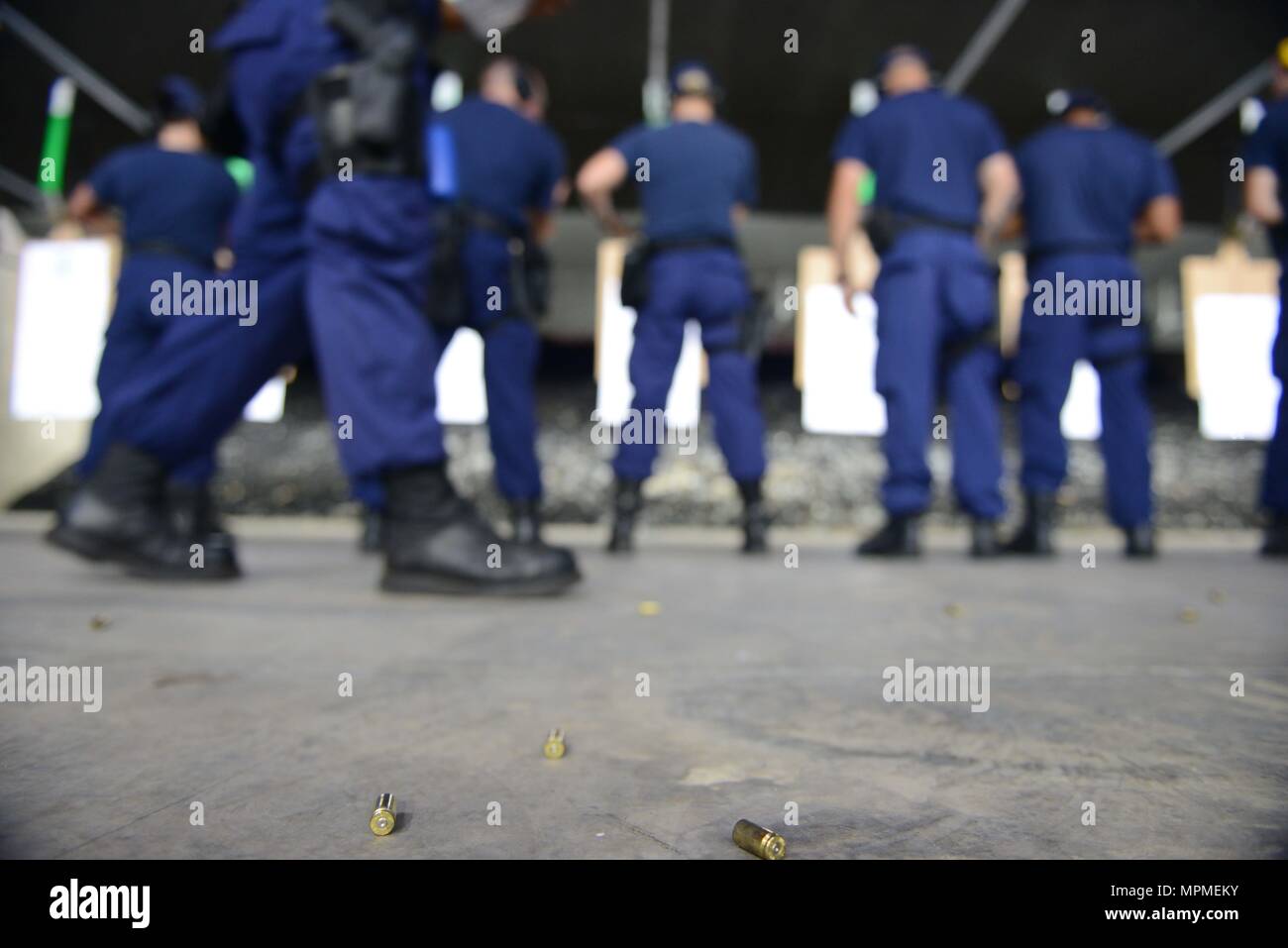 Coast Guard crewmembers conduct a live fire exercise during a Firearms ...