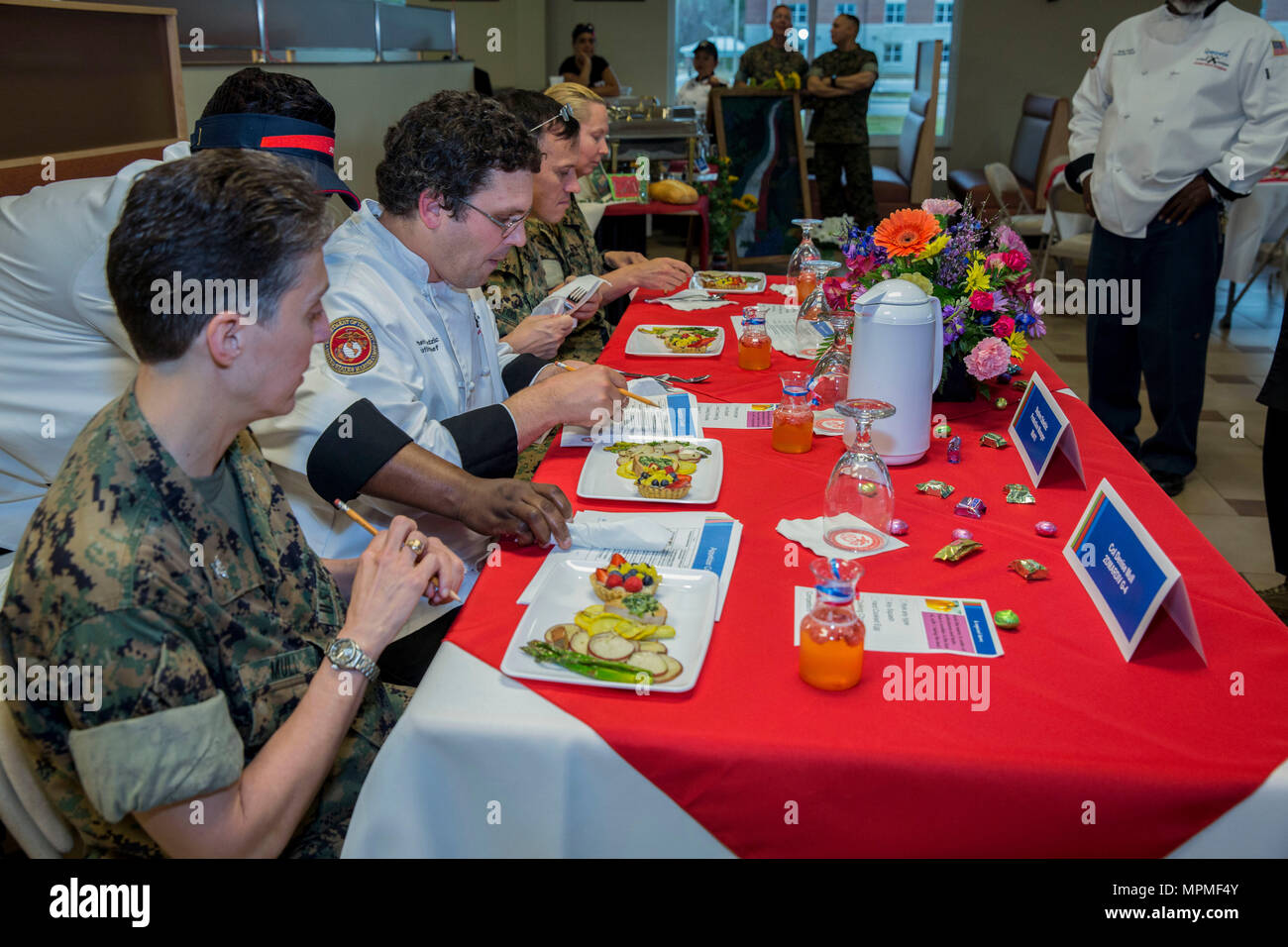 Judges taste and score submissions during a first quarter culinary arts ...