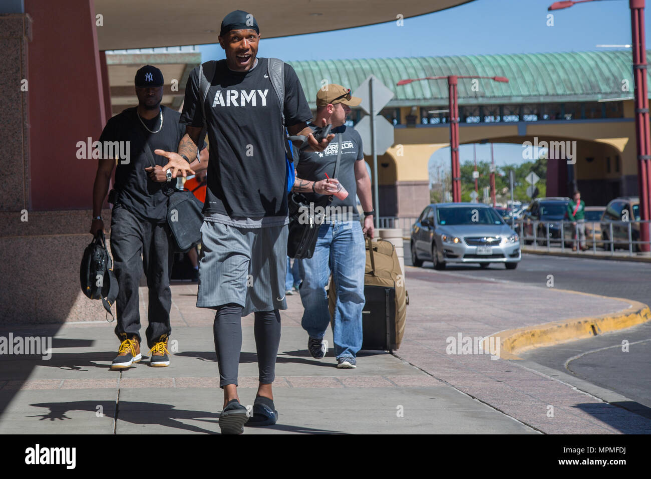 U.S. Army veteran, Adam Blow, poses for a photo while walking to load ...