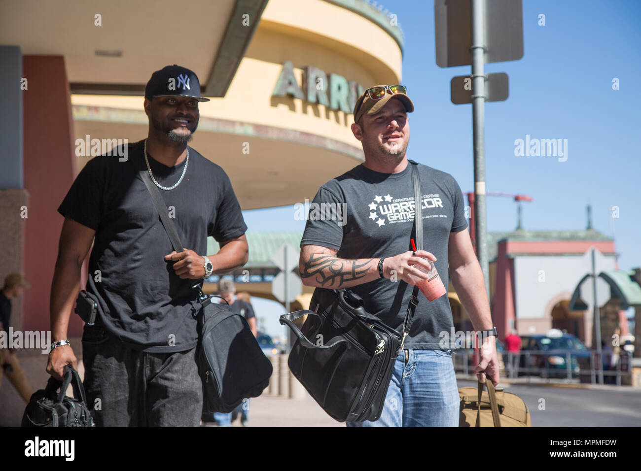 U.S. Army veterans, Patrick Timmins and Charles Hightower, arrive for ...