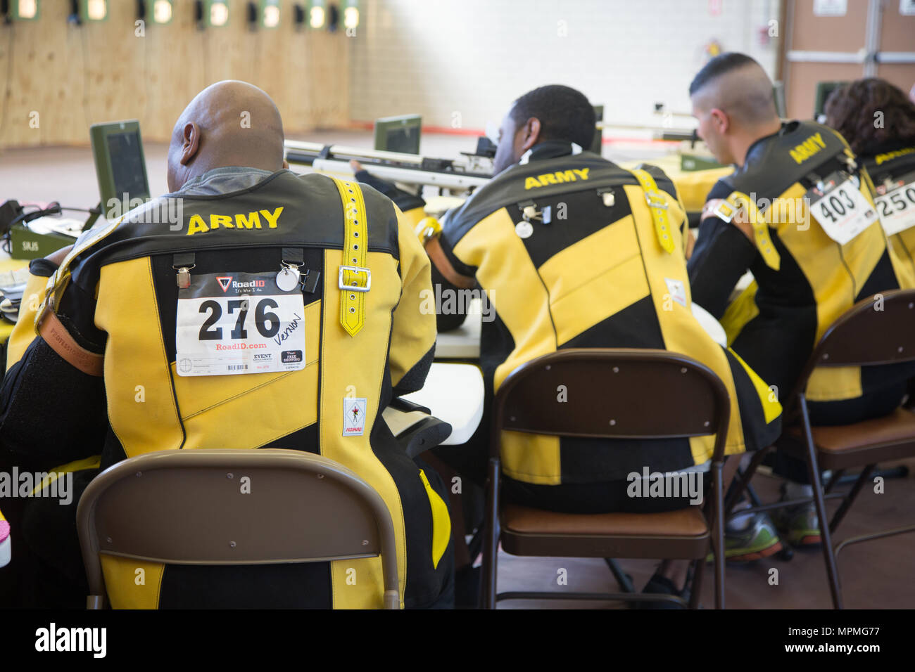 U.S. Army Soldiers and veterans take aim with thier air rifle during ...