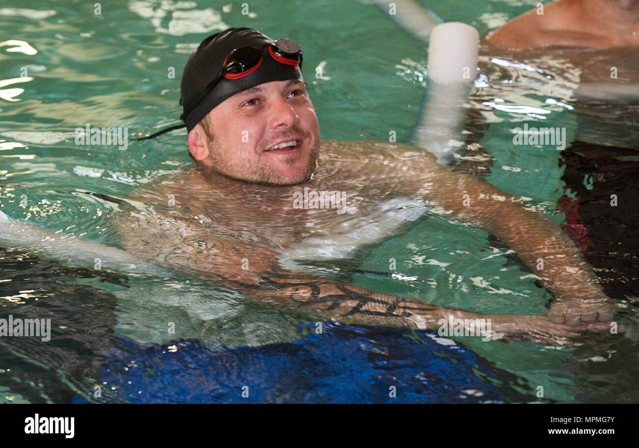 U.S. Army veteran, Patrick Timmins, trains for the swimming event for ...