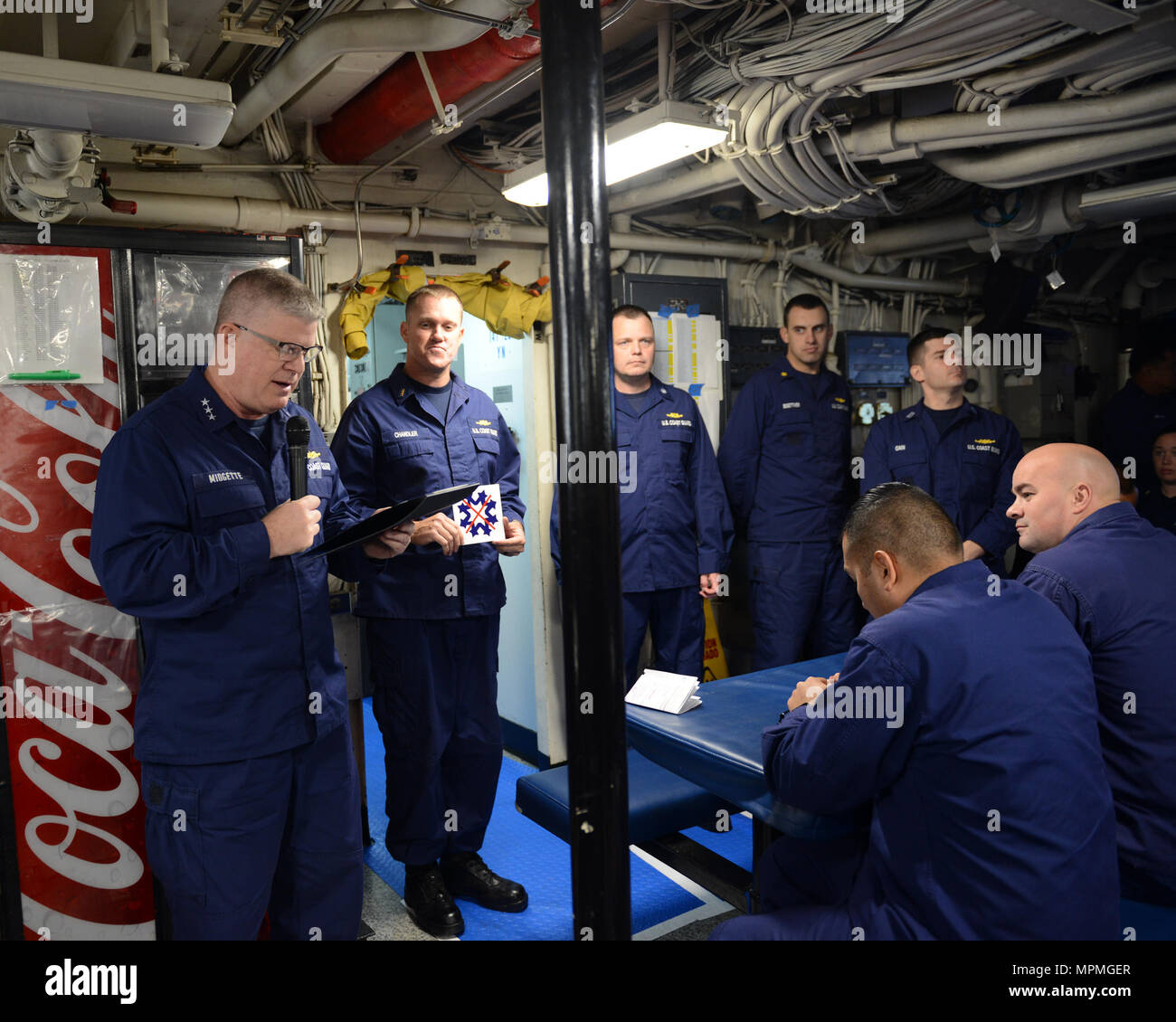 Vice Adm. Fred Midgette, commander, Coast Guard Pacific Area presents a ...