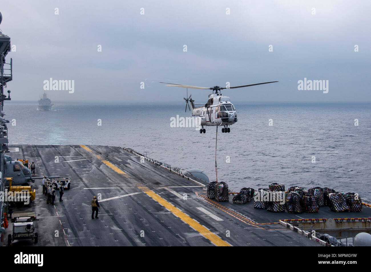 170330-N-TH560-363 EAST CHINA SEA (March 30, 2017) An AS-332 Super Puma ...