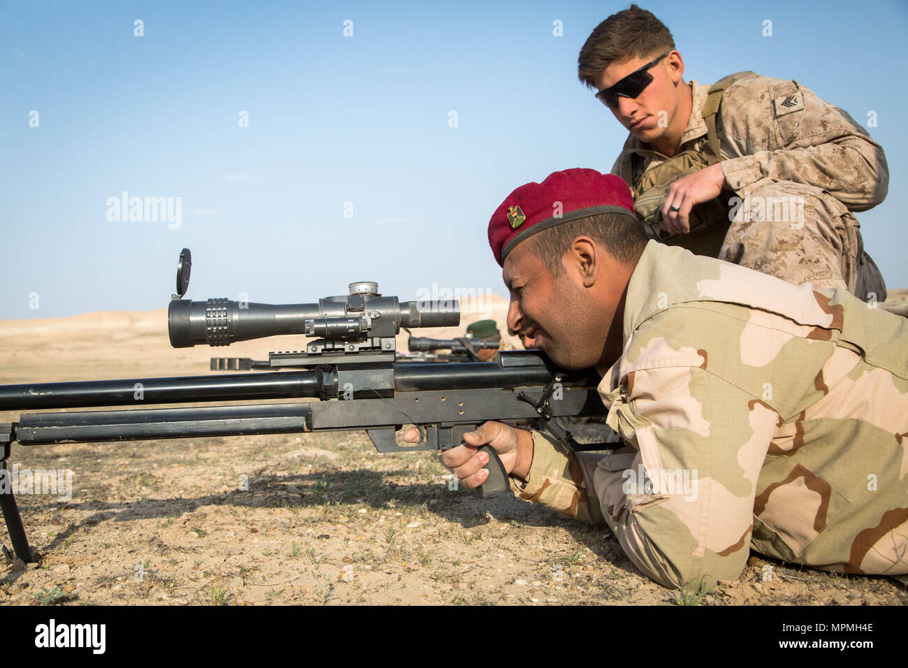 An Iraqi security forces soldier, foreground, practices trigger squeeze ...