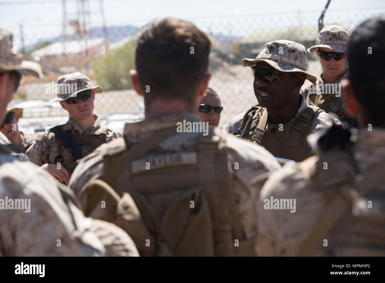 U.S. Marine Corps GySgt. Ricardo O. Marston, right, an infantry unit ...