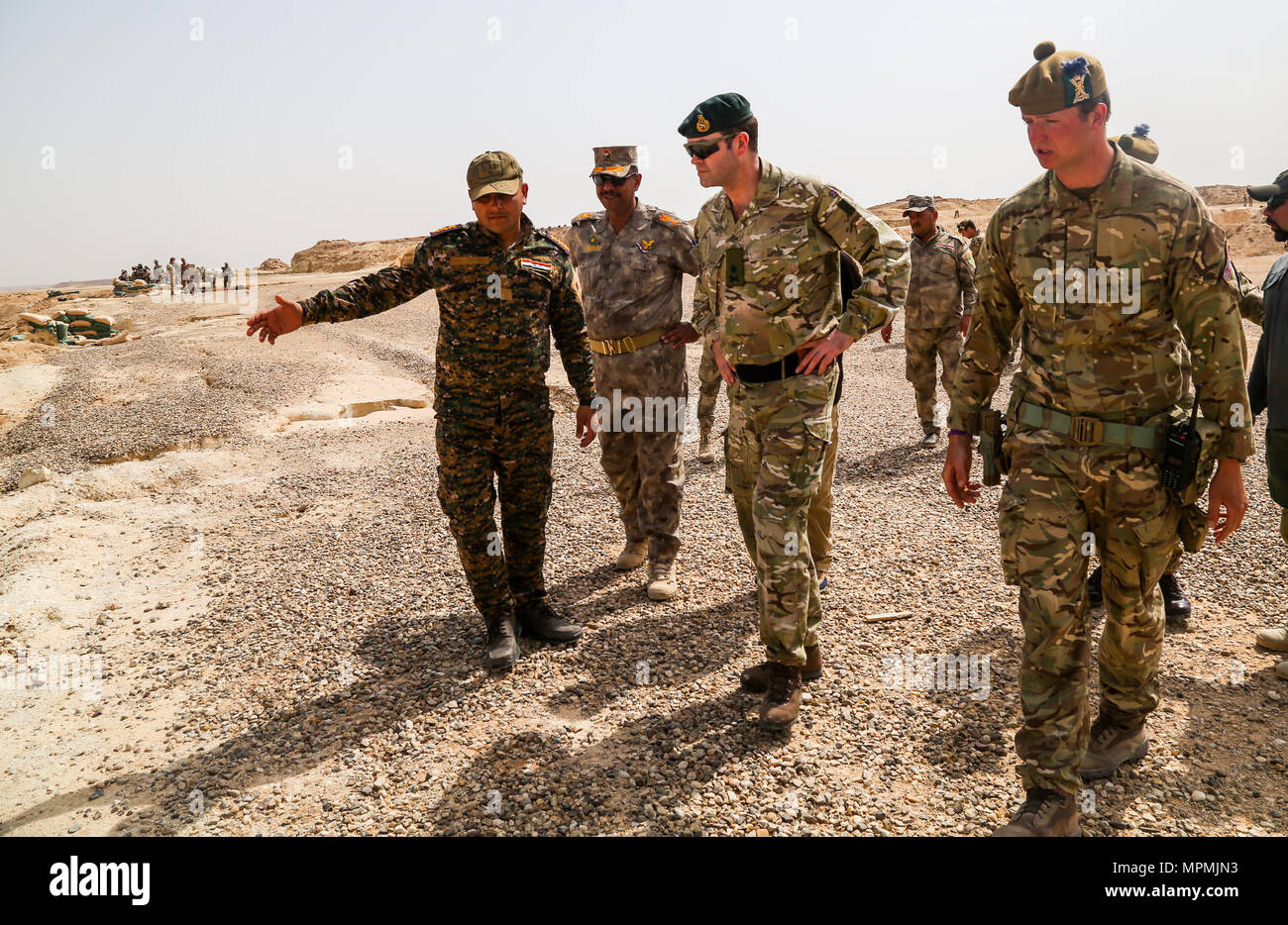 United Kingdom Lt. Gen. Patrick Sanders, commander, Field Army, center, and British soldiers ...