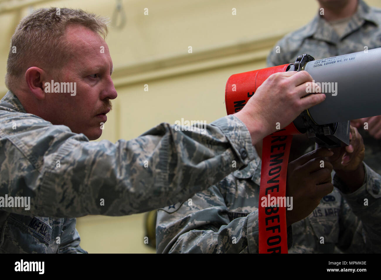 U.S. Air Force Col. Joseph McFall, 52nd Fighter Wing commander, secures ...