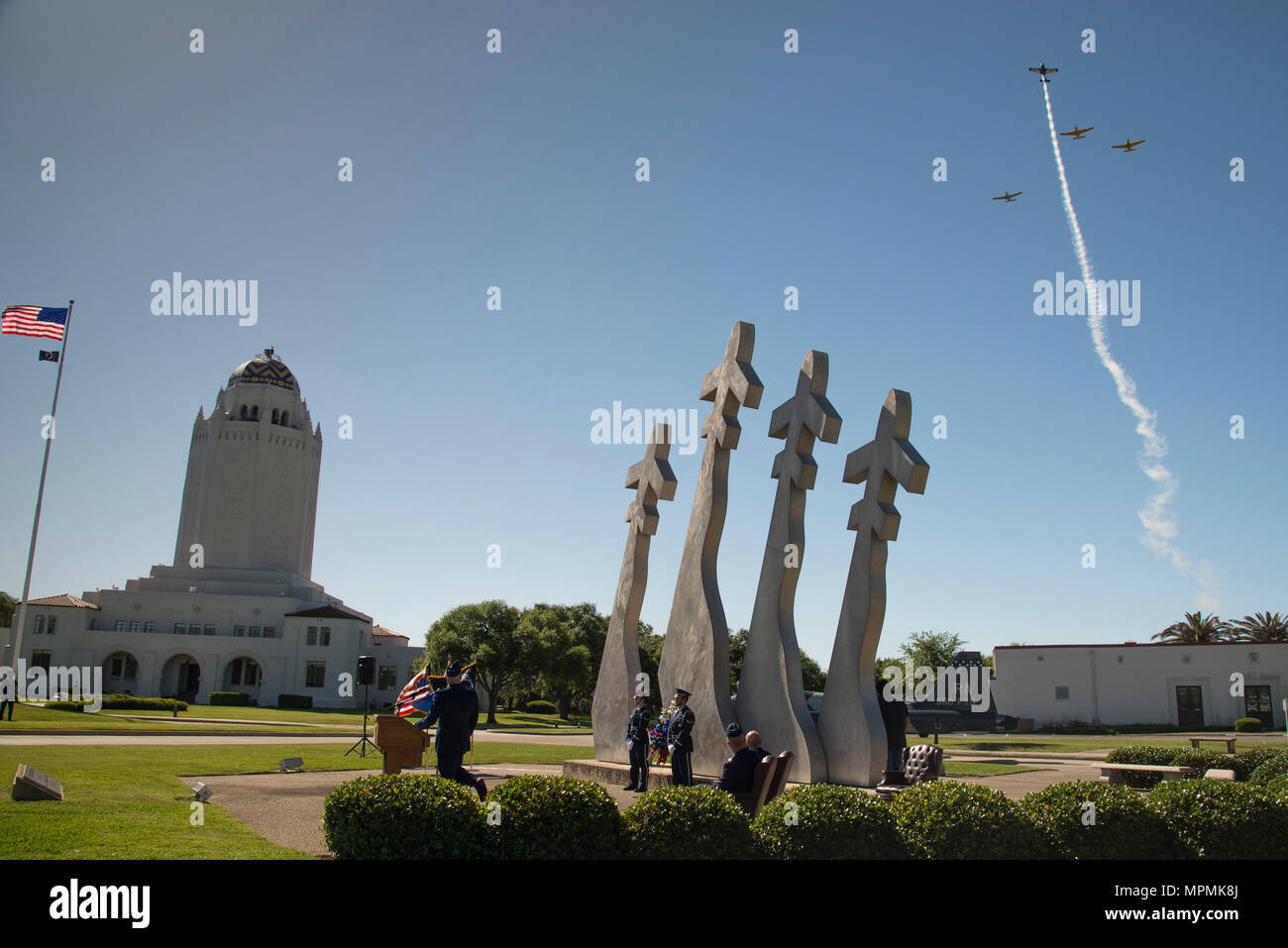 A formation of T-34 Mentors perform a missing man flyover during the ...