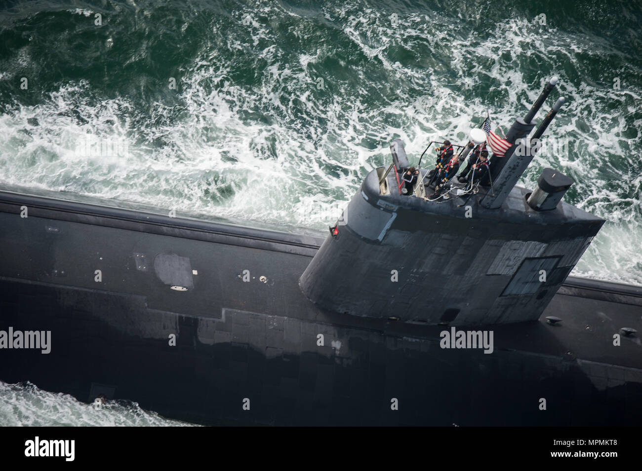 Sailors assigned to the Los Angeles-class fast attack submarine USS ...