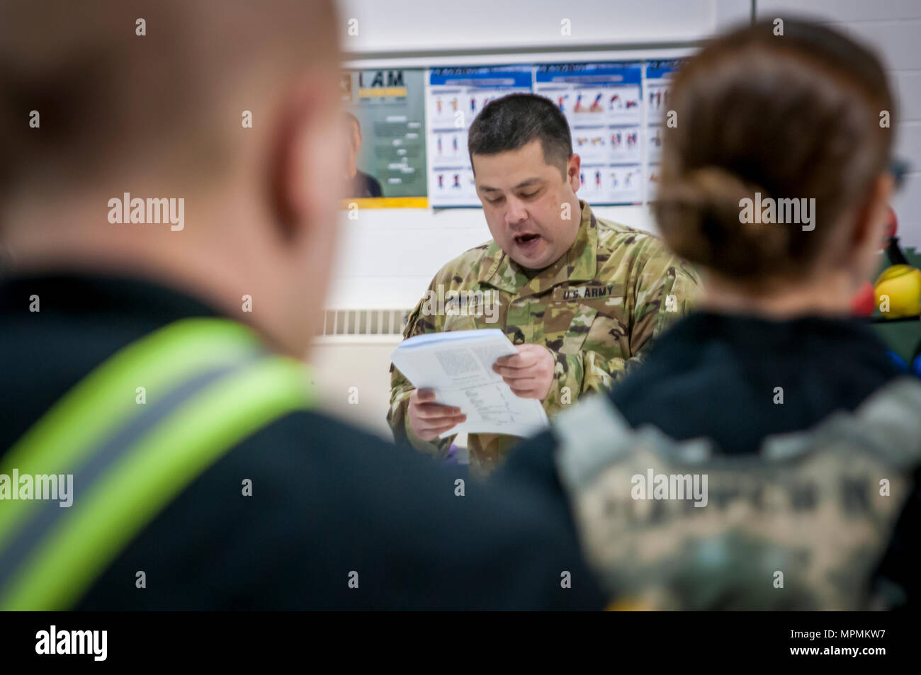 Sergeant 1st Class Gregory Porter reads the instructions for the two ...
