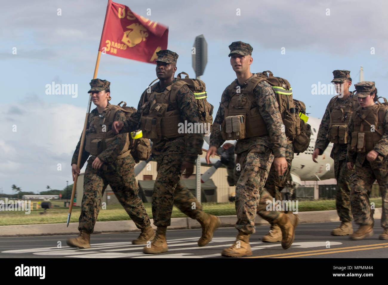 Marines with Alpha Company, 3rd Radio Battalion, conduct a unit hike ...