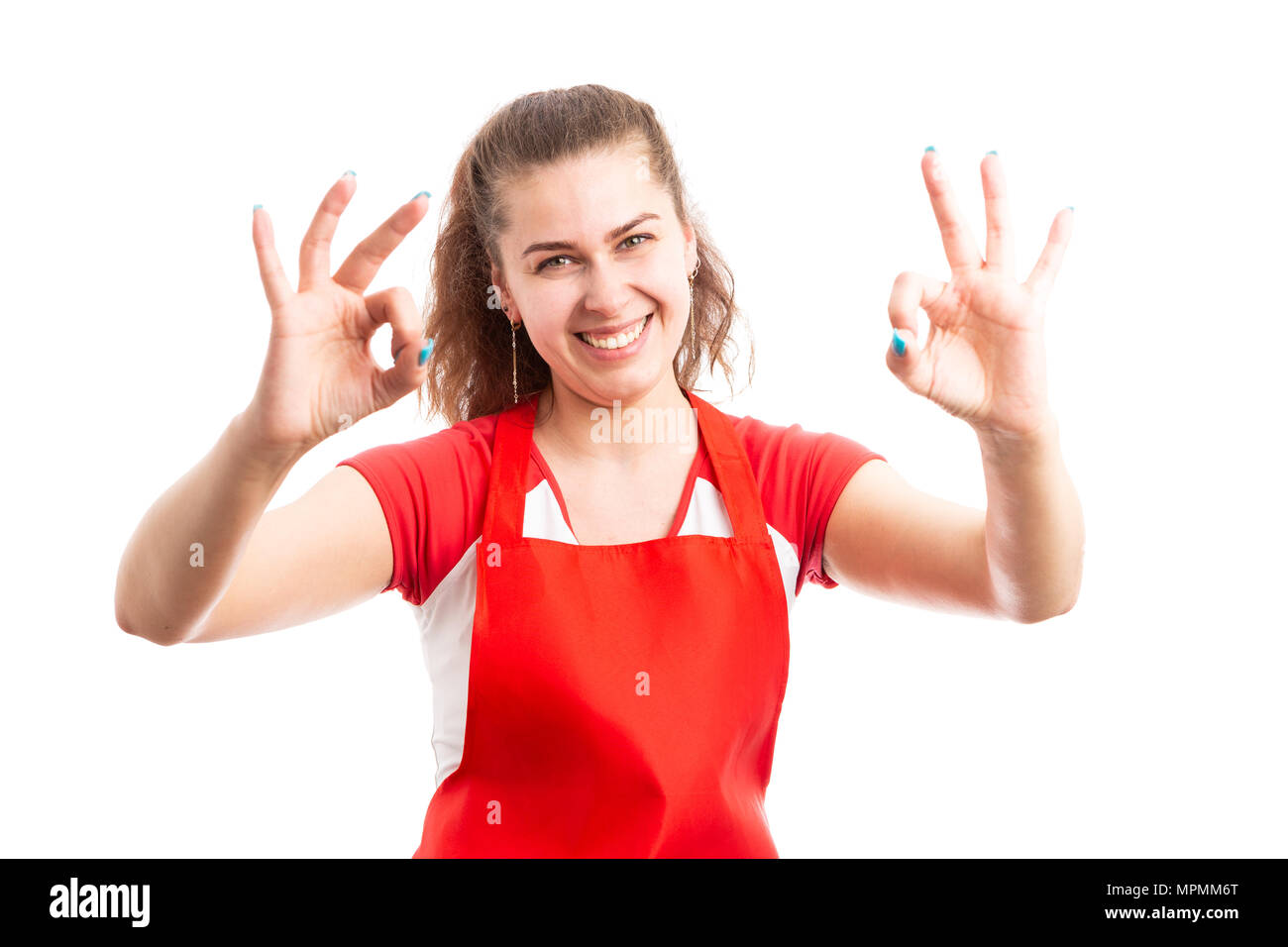 Young woman supermarket worker making ok gesture with hands and smiling ...