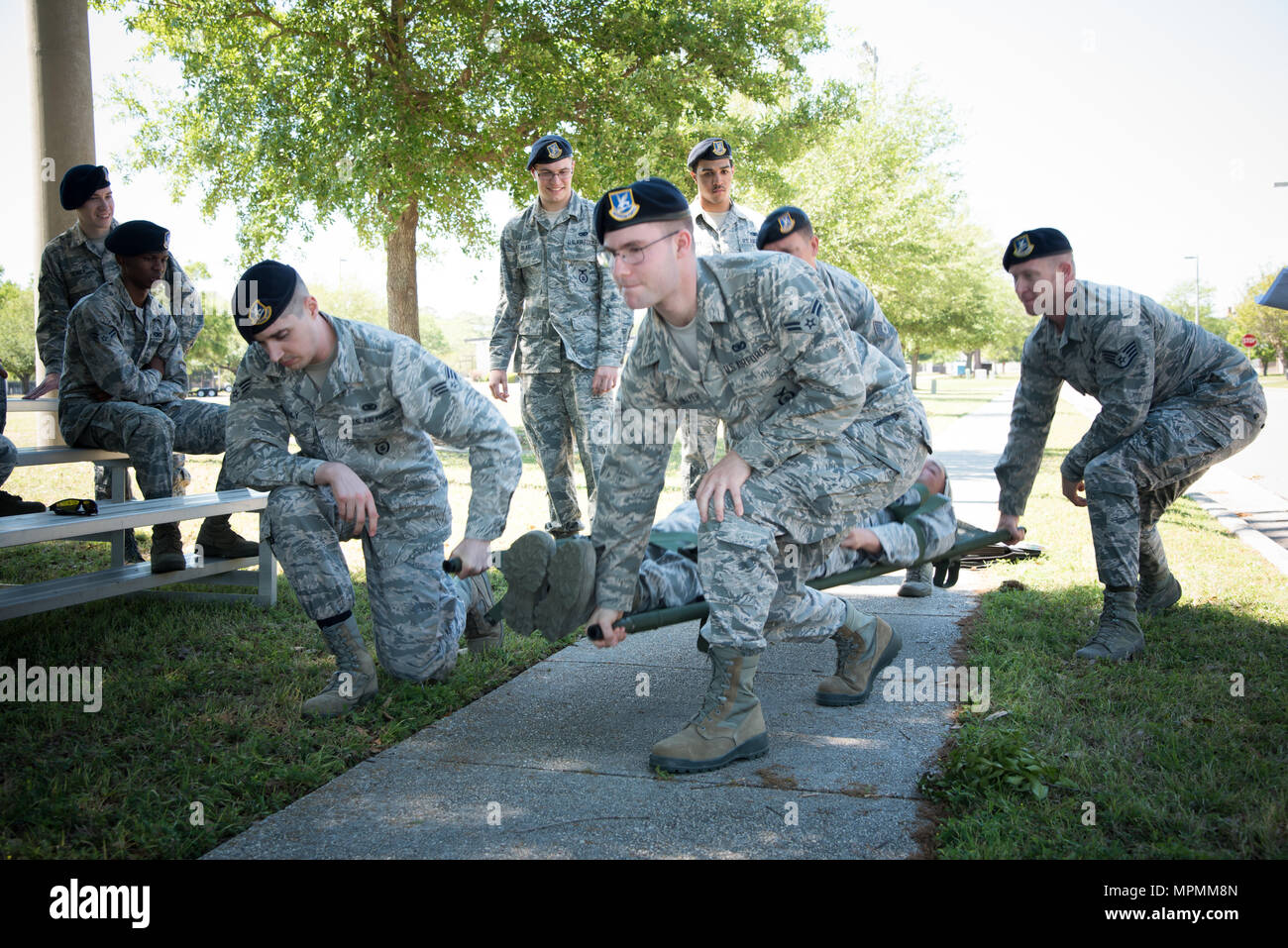 Members of the 403rd Security Forces Squadron practice a litter carry ...