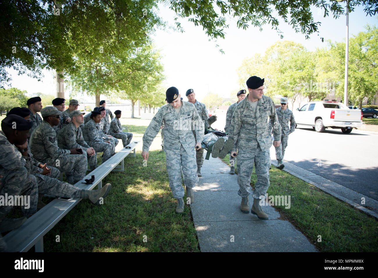Members of the 403rd Security Forces Squadron practice a litter carry ...