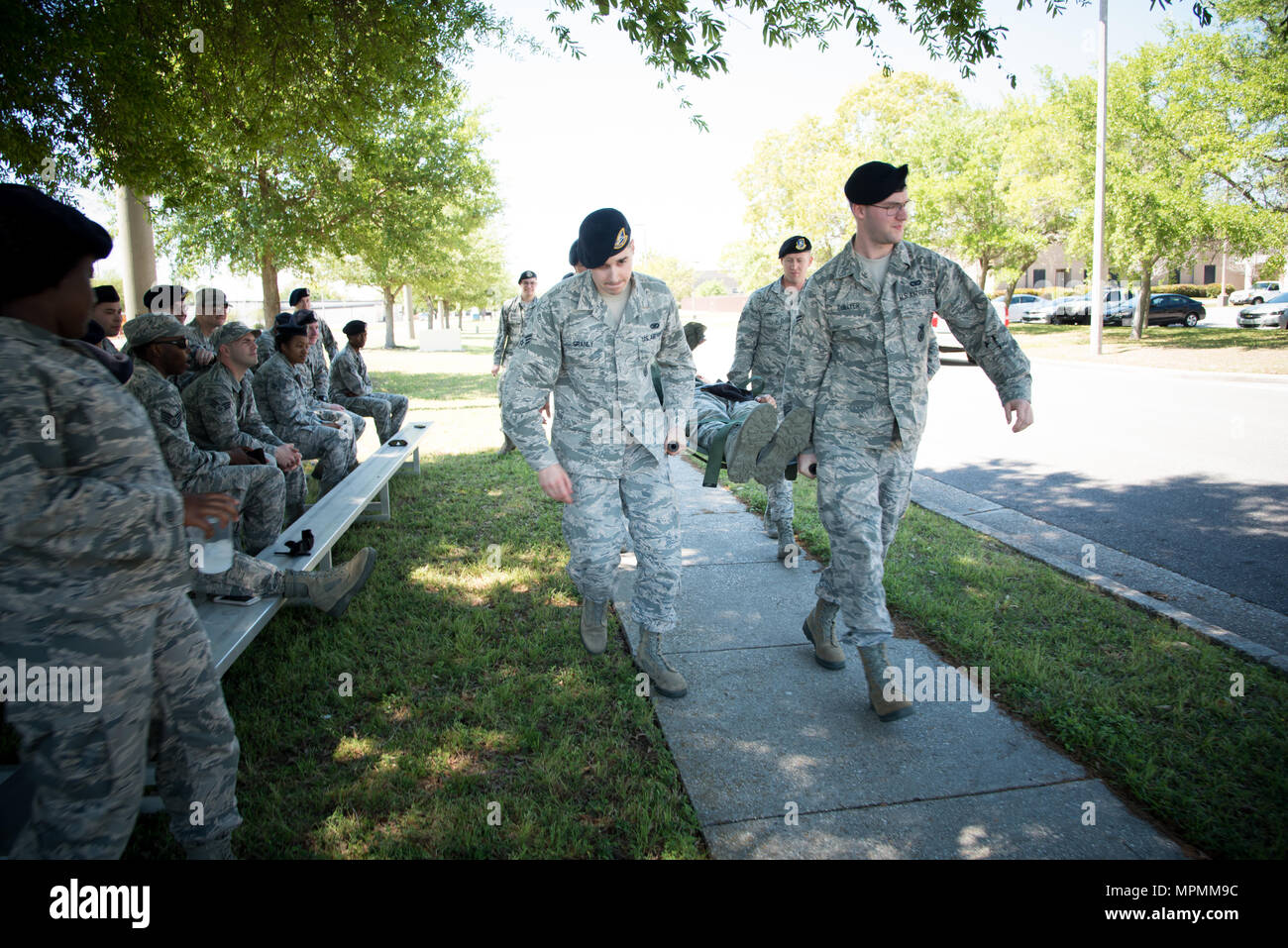 Members of the 403rd Security Forces Squadron practice a litter carry ...