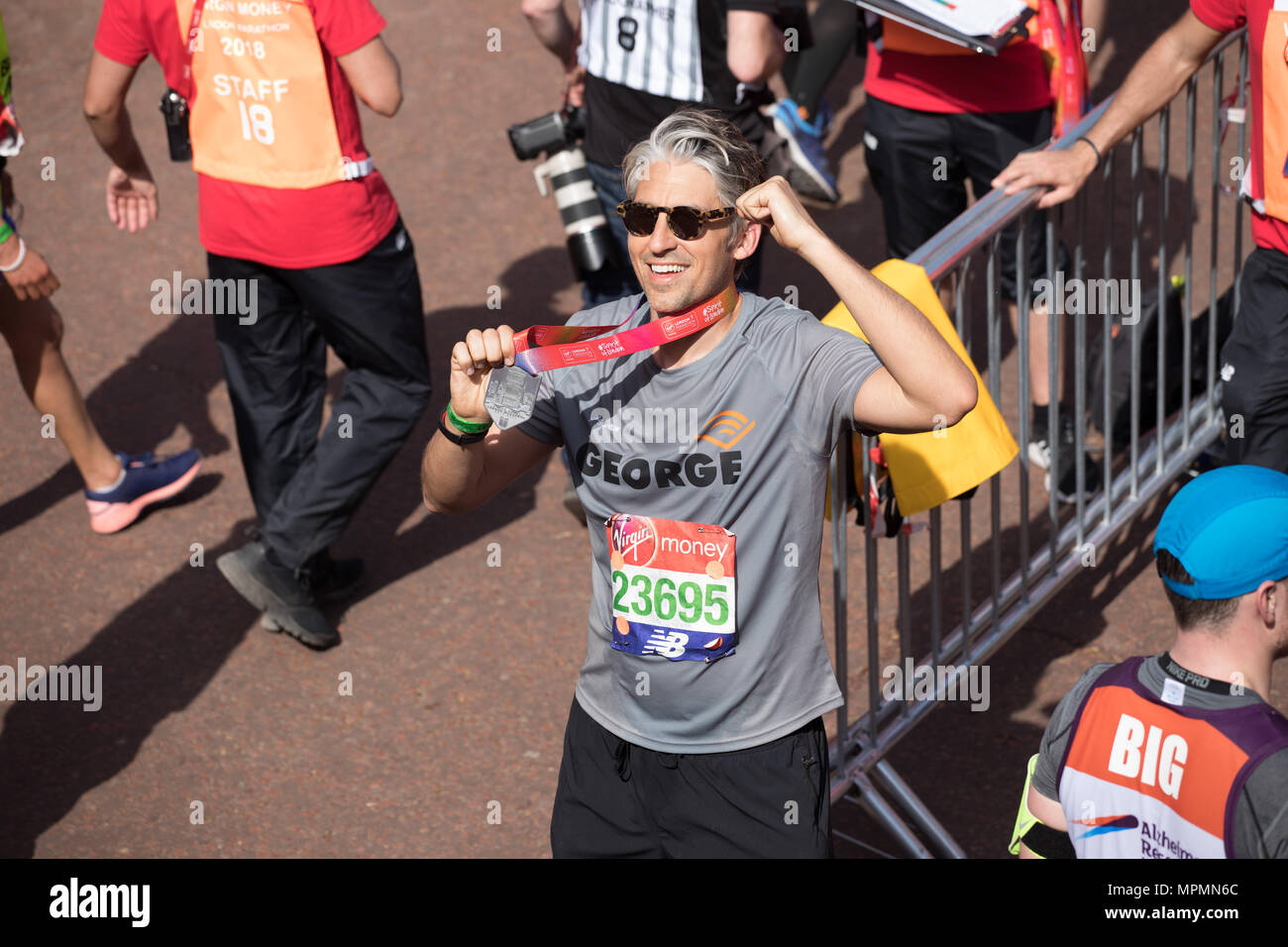 Runners at the finish line for at The Virgin London Marathon Featuring ...