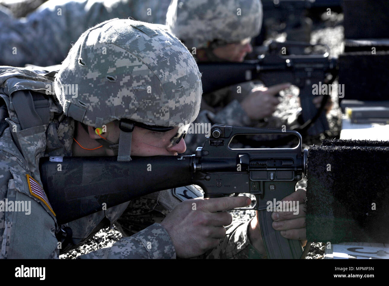 A Soldier qualifies with an M-16 rifle during the Nebraska National ...