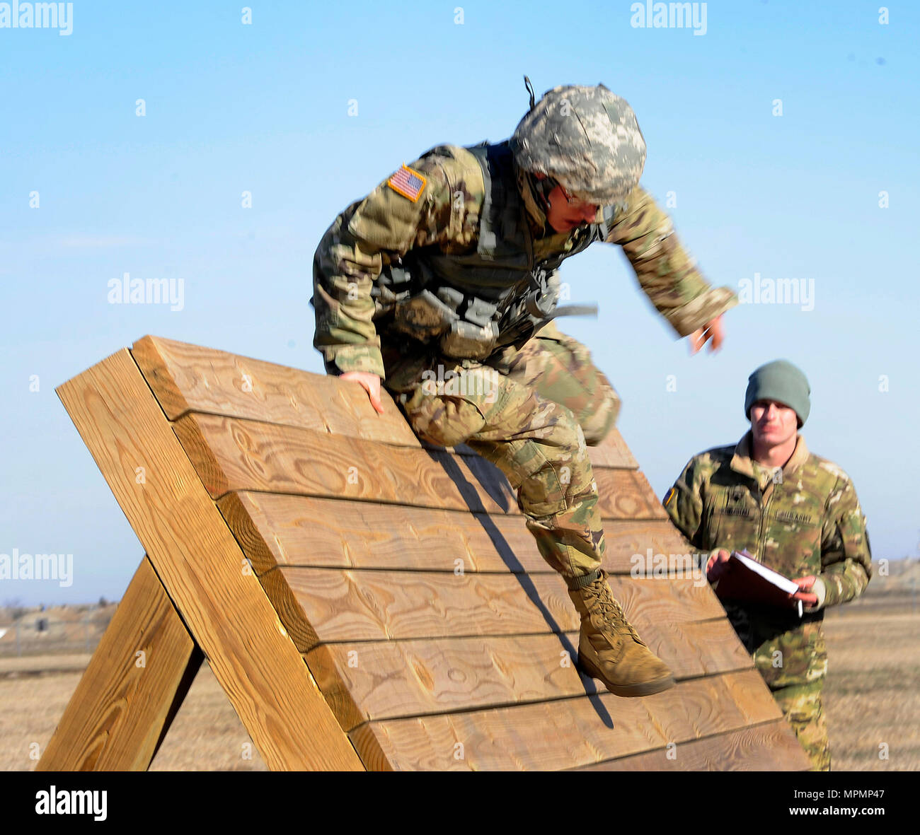 Nebraska National Guard Spc. Ryan Marshall maneuvers over the final ...