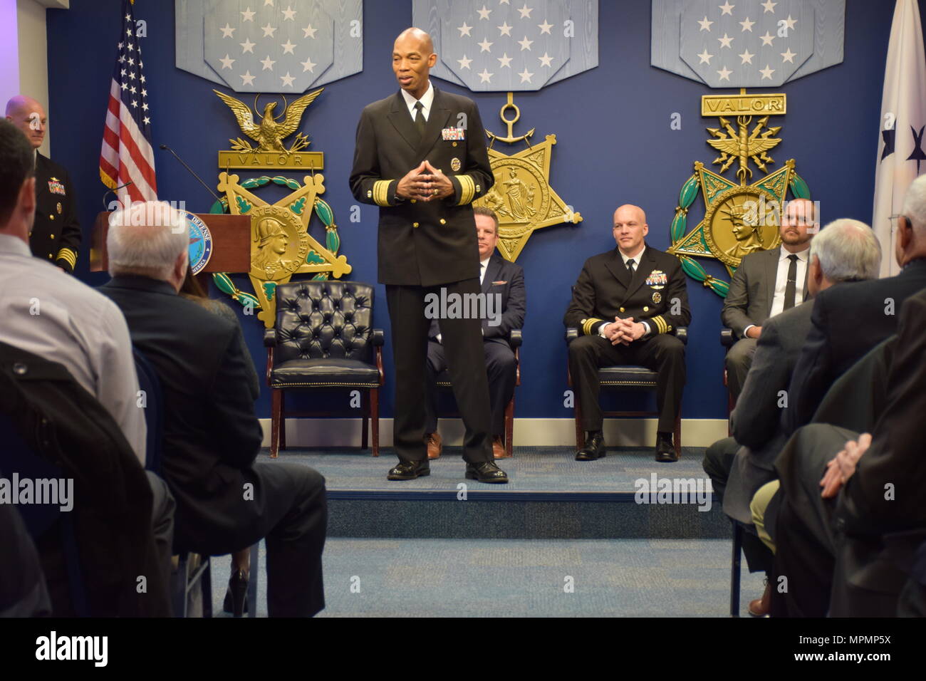 Cmdr. Michael Adams retires during a ceremony attended by family ...