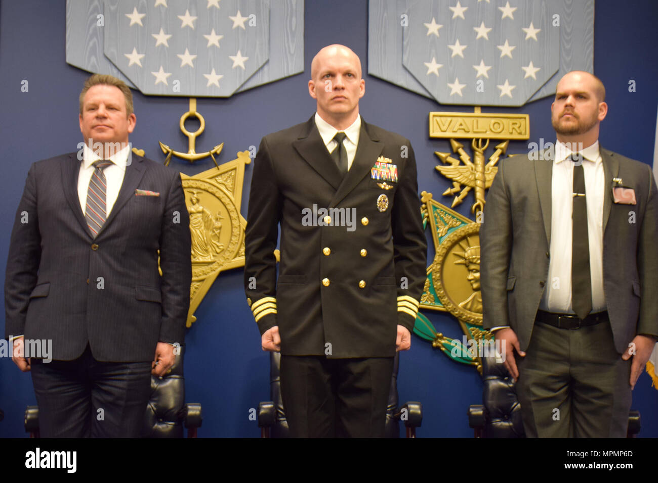 Cmdr. Michael Adams retires during a ceremony attended by family ...