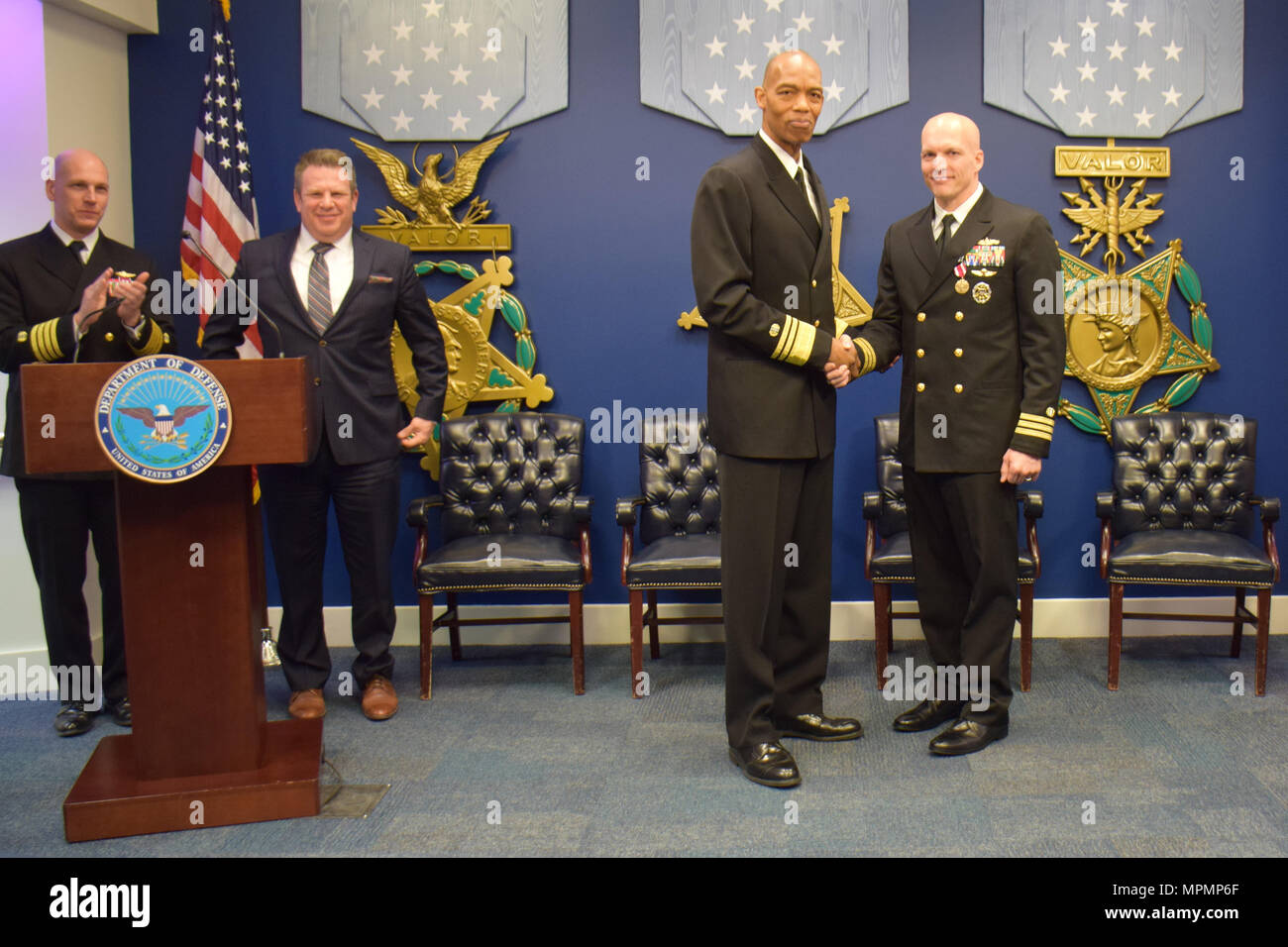 Cmdr. Michael Adams retires during a ceremony attended by family ...