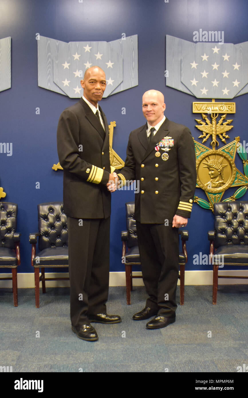Cmdr. Michael Adams retires during a ceremony attended by family ...