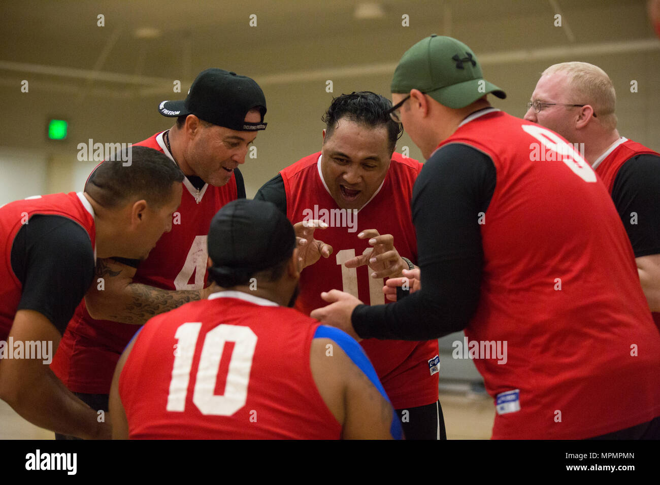 U.S. Army veterans and Soldiers huddle together before training for the ...