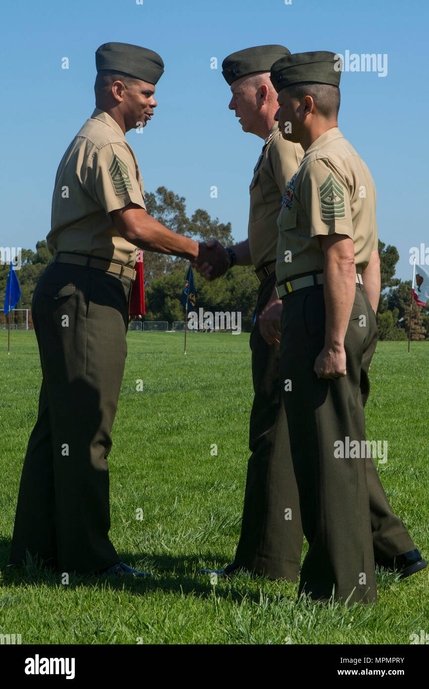 U.S. Marine Sgt. Maj. Lonnie N. Travis (left) receives an award from ...