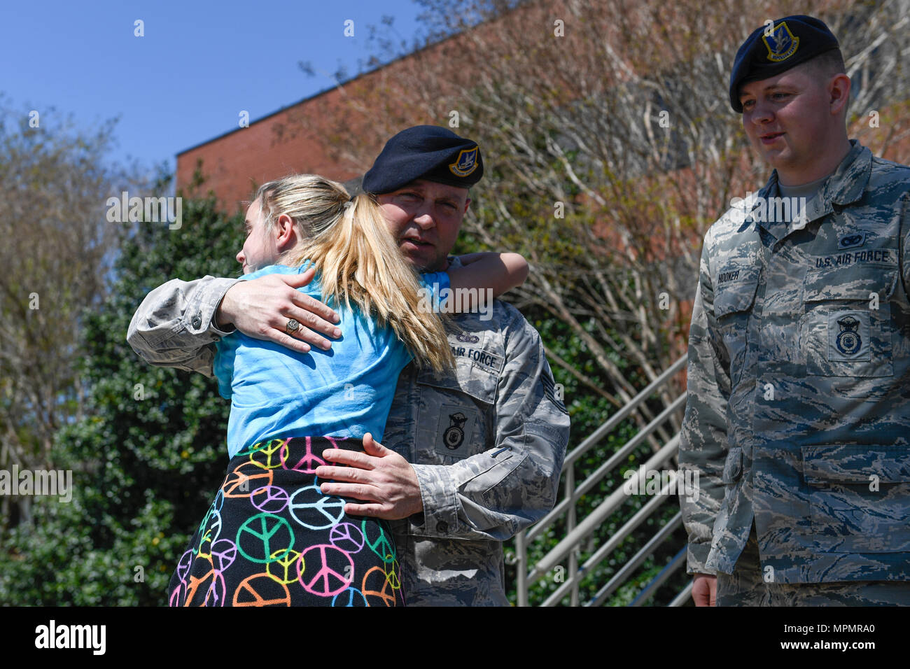 Alex Kresge, Girl Scout, hugs and thanks U.S. Air Force Tech. Sgt. Adam ...