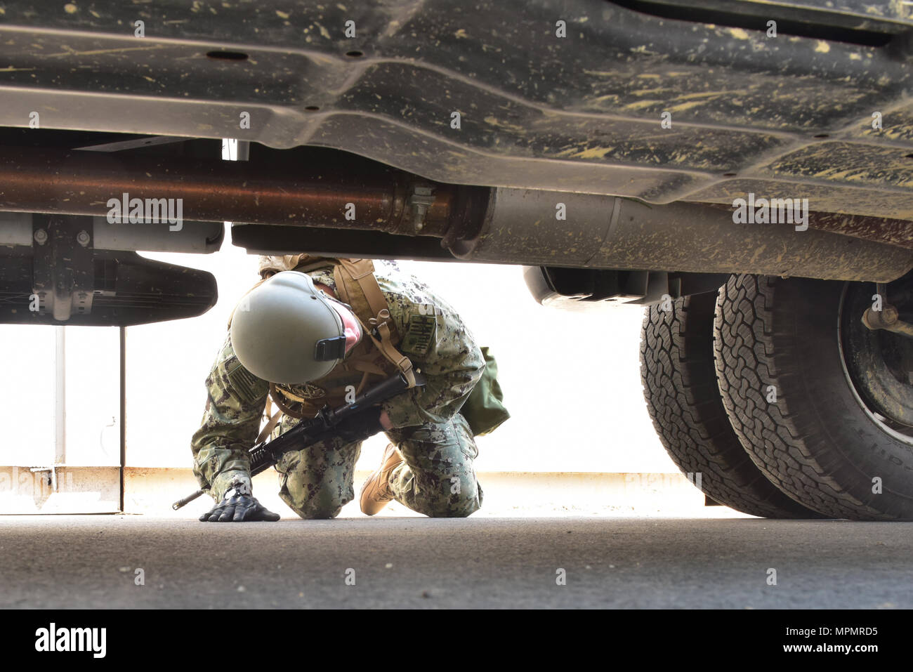 Petty Officer 2nd Class Alexander Hiller, a maritime enforcement ...