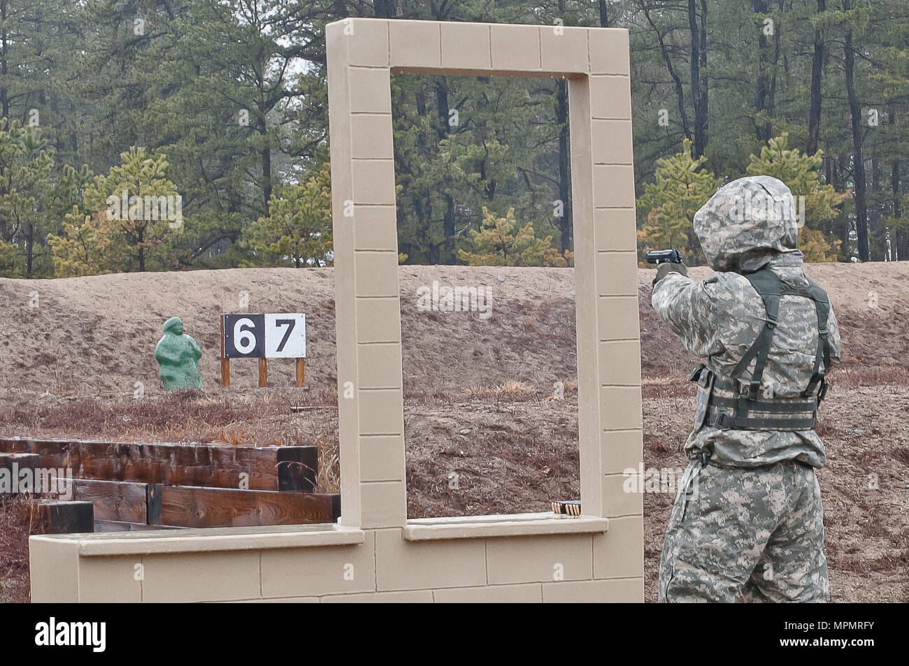A Soldier takes aim during the M9 pistol marksmanship event of the Best ...