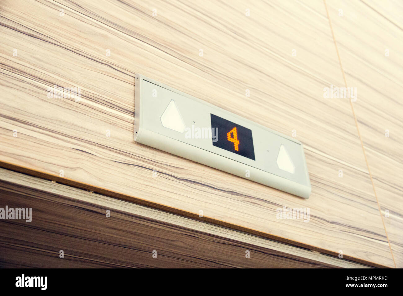 Above elevator door electronic digital display with number four floor ...
