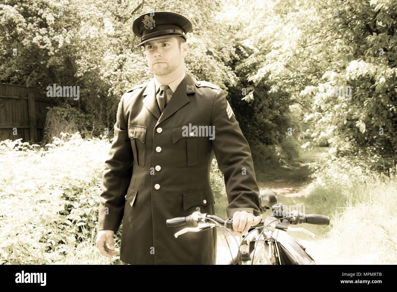 Handsome American WWII GI Army officer in uniform walking home with his ...