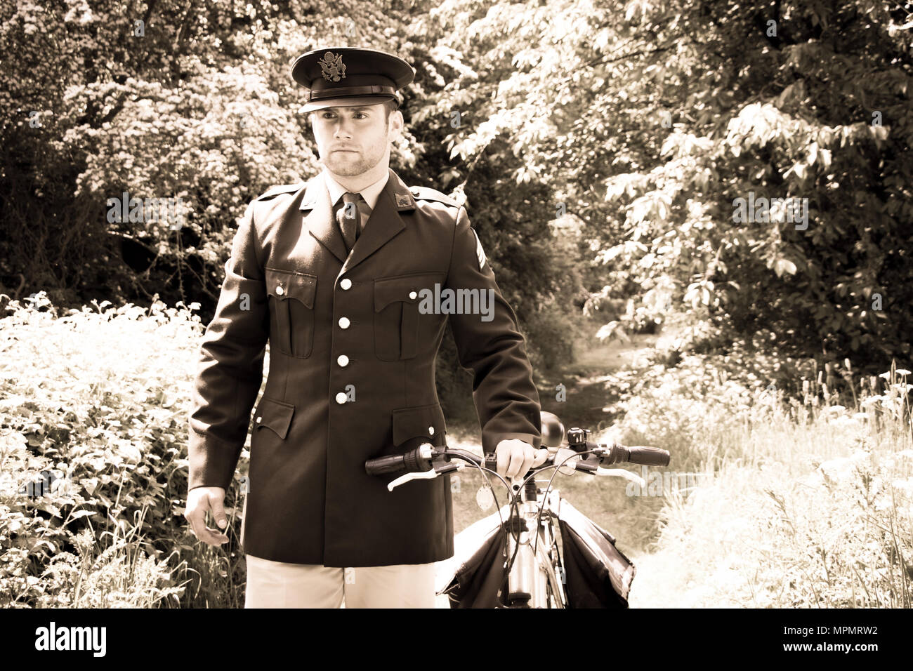Handsome American WWII GI Army officer in uniform walking home with his ...