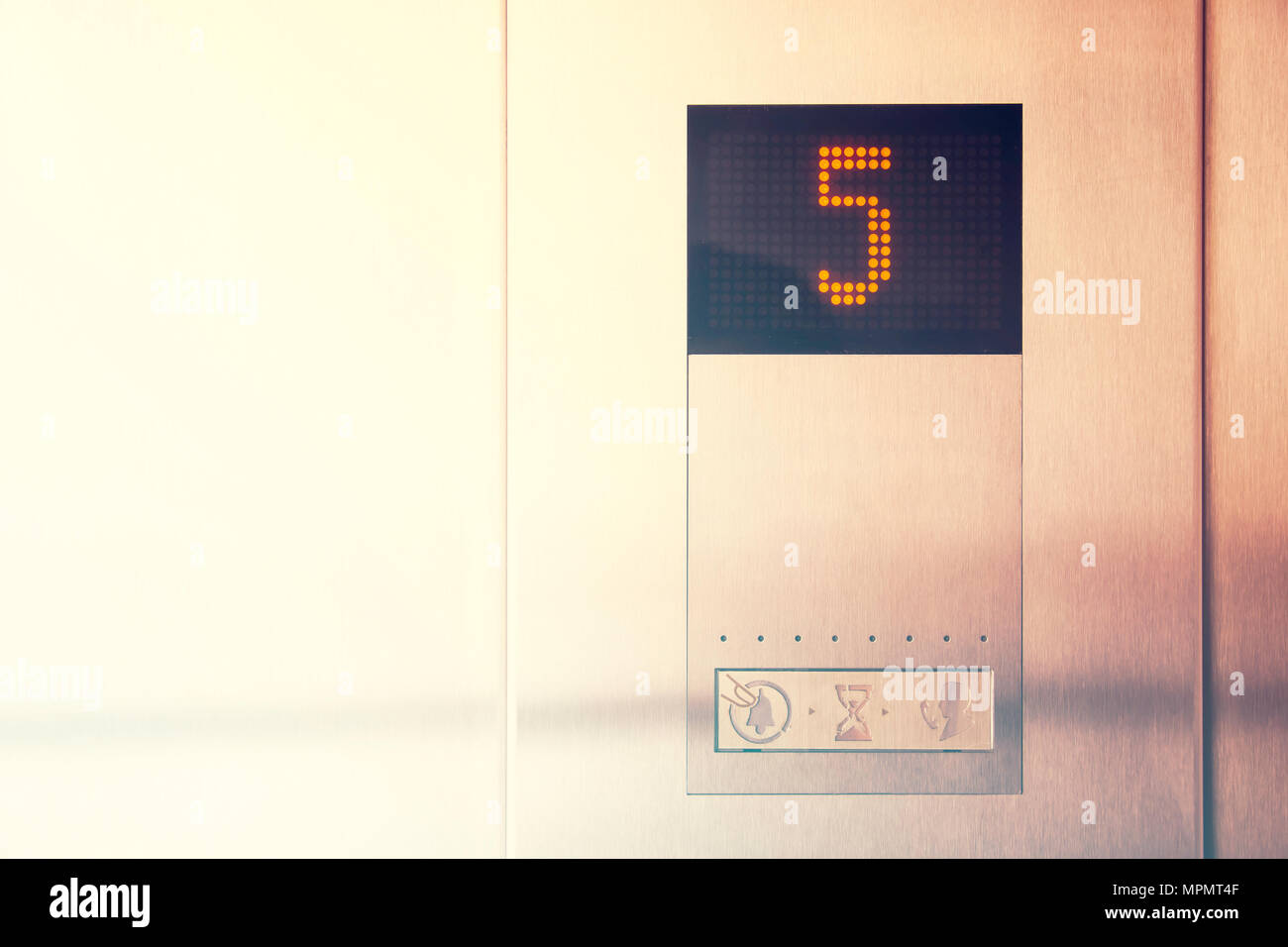 Monitor show number five floor in metal modern elevator Stock Photo - Alamy