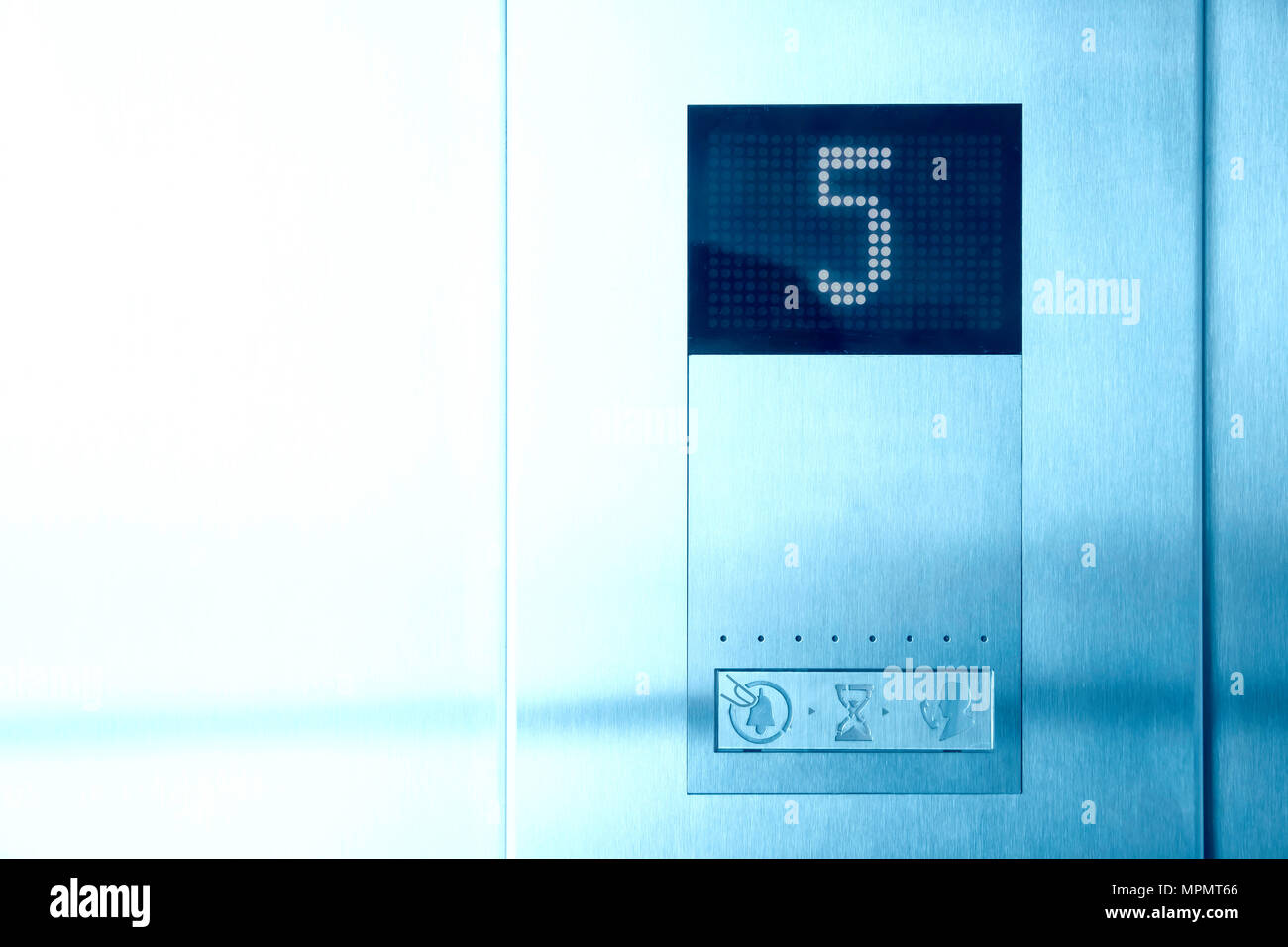 Floor number five on electronic LCD display in elevator of modern ...