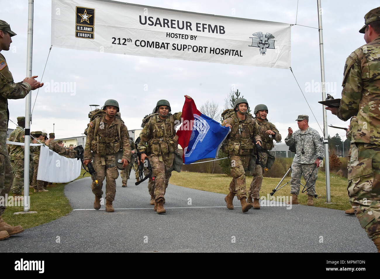 U. S. Soldiers with the 173rd Airborne Brigade cross the finish line ...