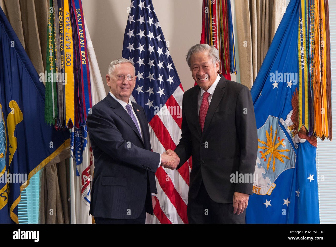 Defense Secretary Jim Mattis stands with Singapore’s Minister of ...
