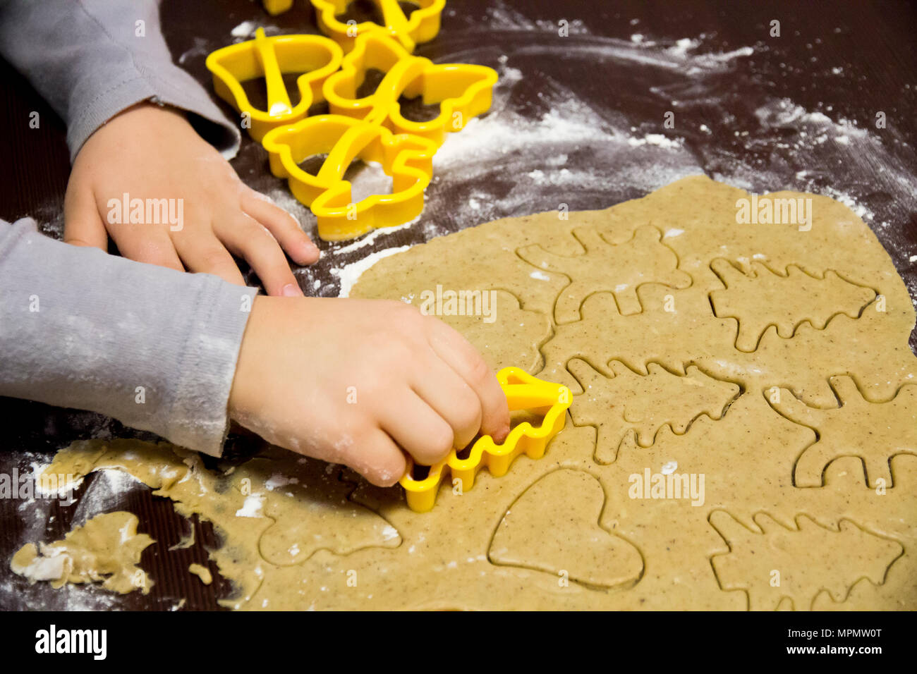 Children's hands cut ginger bread from dough Stock Photo - Alamy