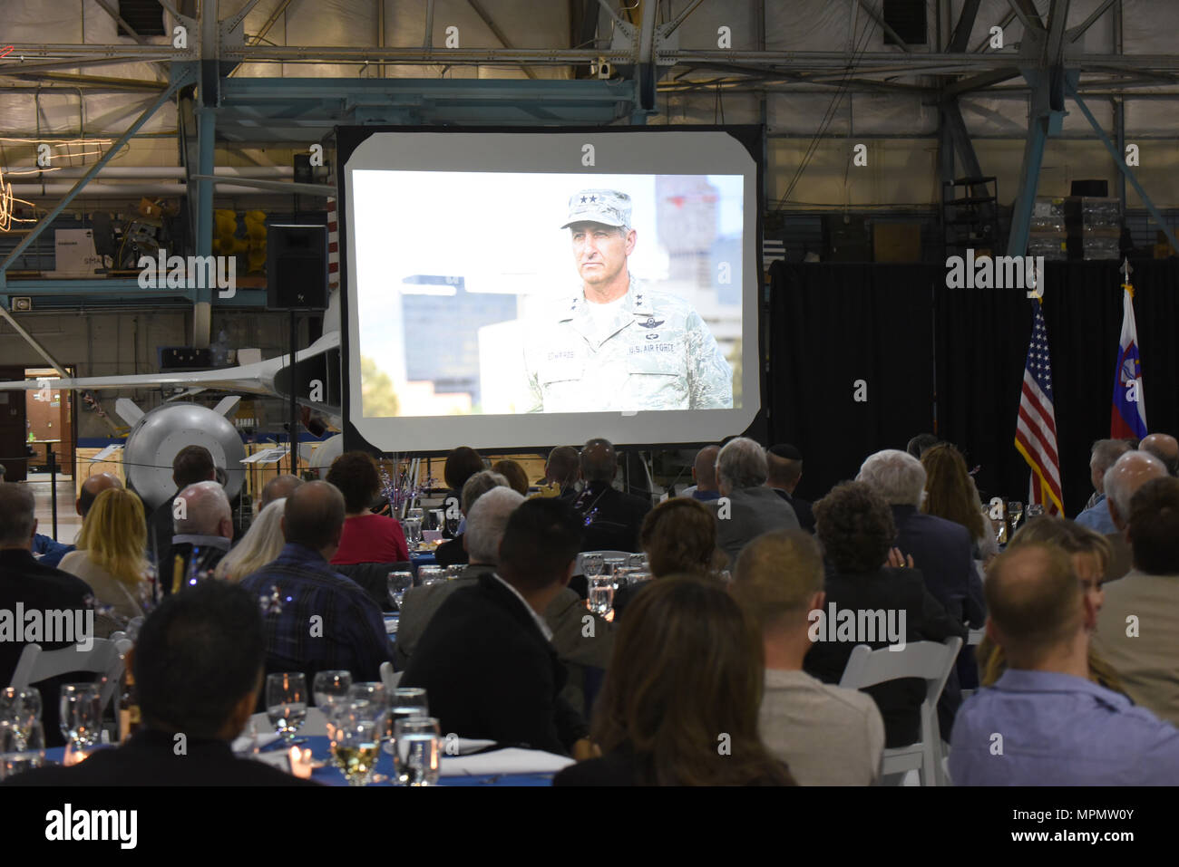 An audience watches a video dedicated to United States Air Force Maj ...