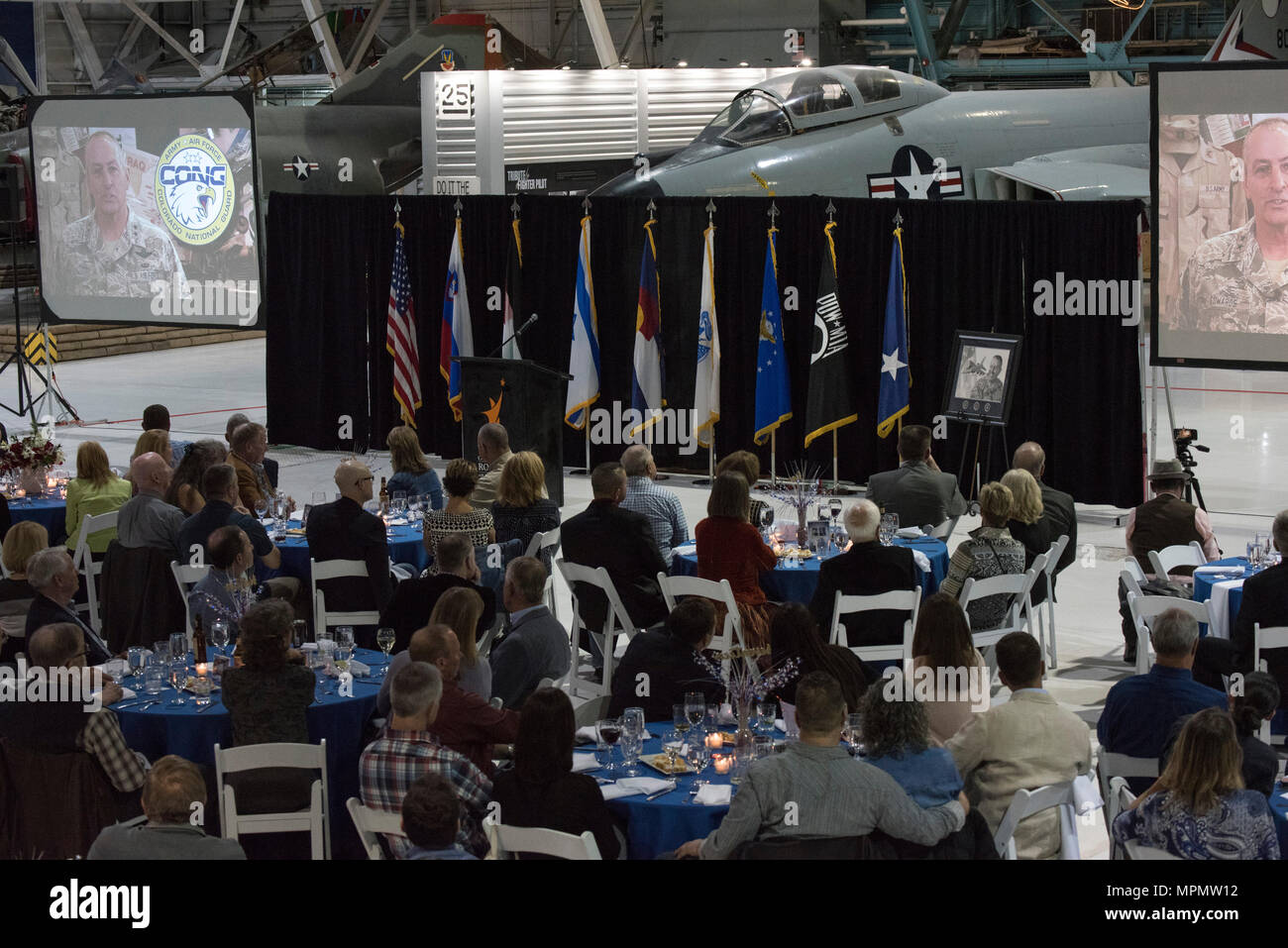 An audience watches a video dedicated to United States Air Force Maj ...