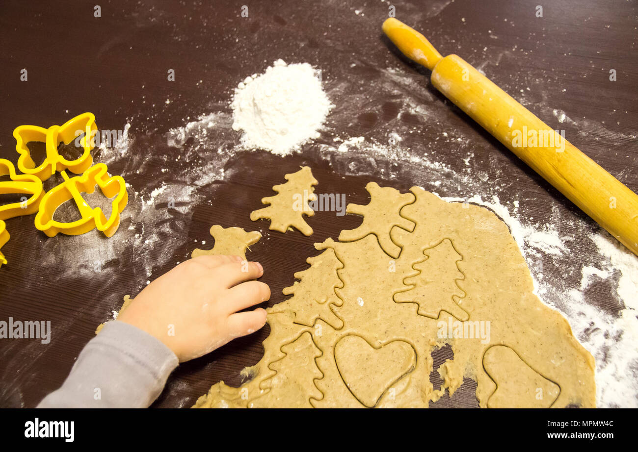 Children's hands cut ginger bread from dough Stock Photo - Alamy