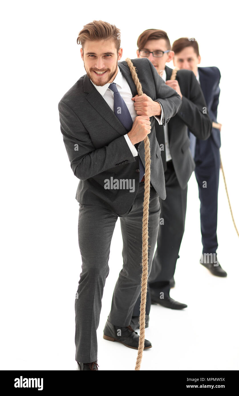 closeup.smiling business team pulls the rope Stock Photo - Alamy